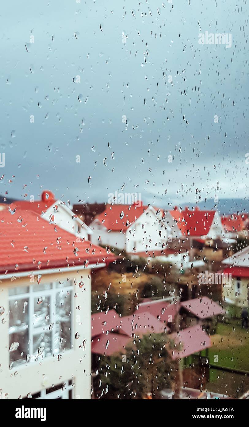 Raindrops on the window. Outside the window streetscape Stock Photo - Alamy