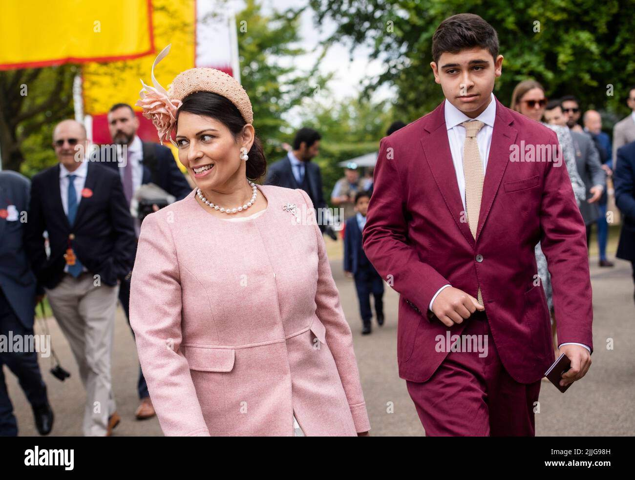 Home Secretary Priti Patel And Her Son Freddie Sawyer Aged 13 Arrive On Day One Of The Qatar