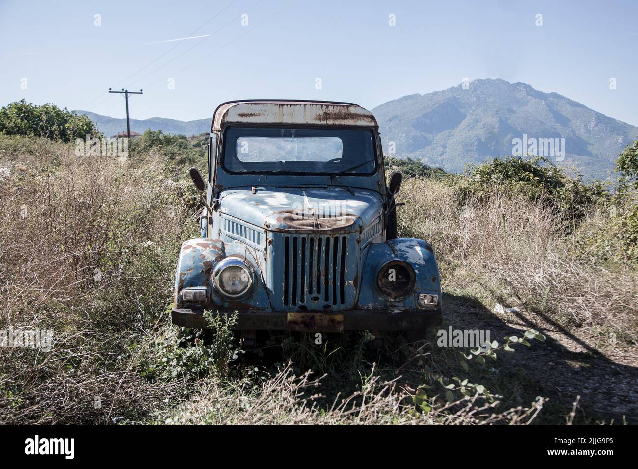 An Old rusty blue truck for transporting food or animals in the Greek ...