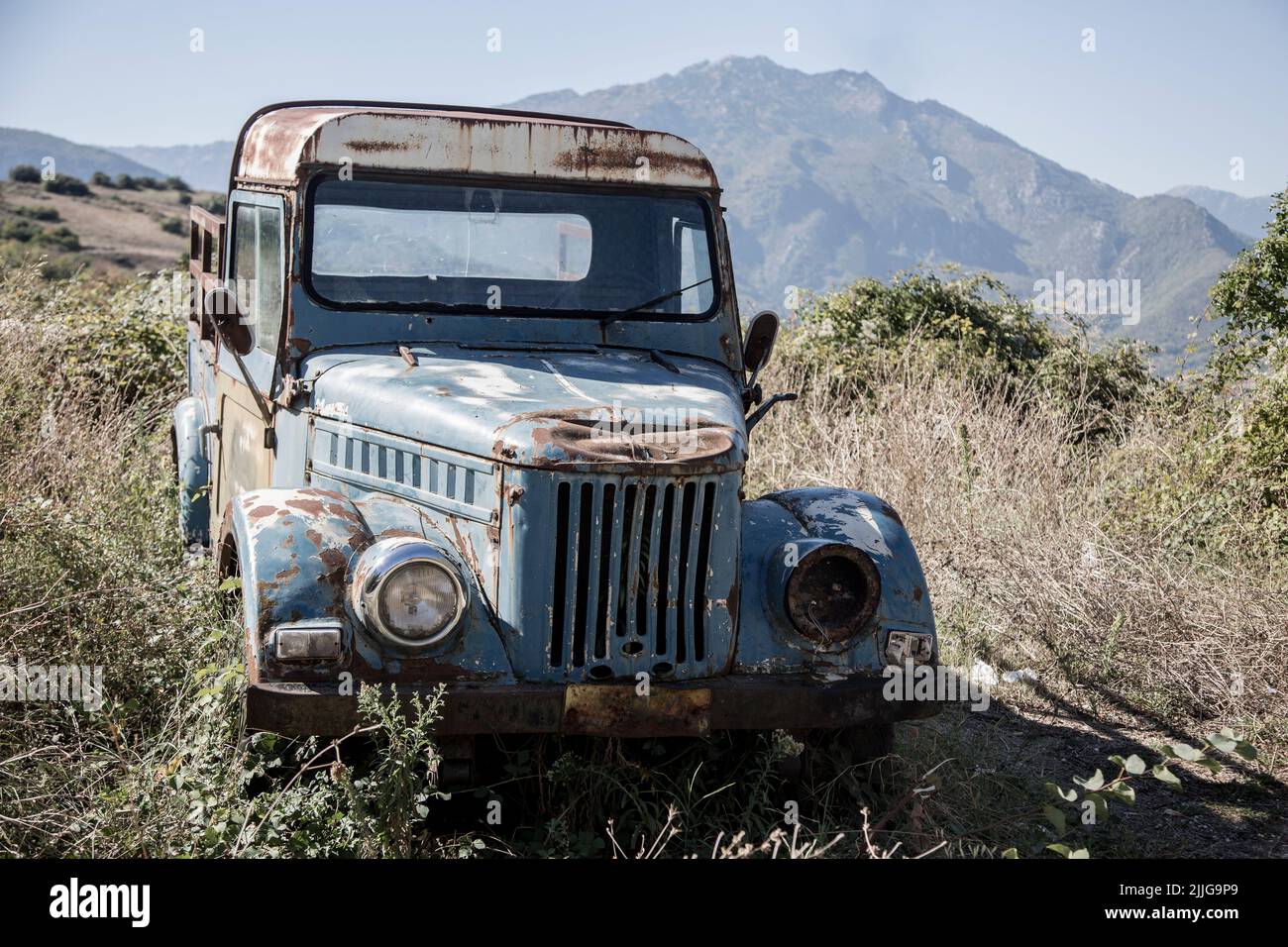 An Old rusty blue truck for transporting food or animals in the Greek ...
