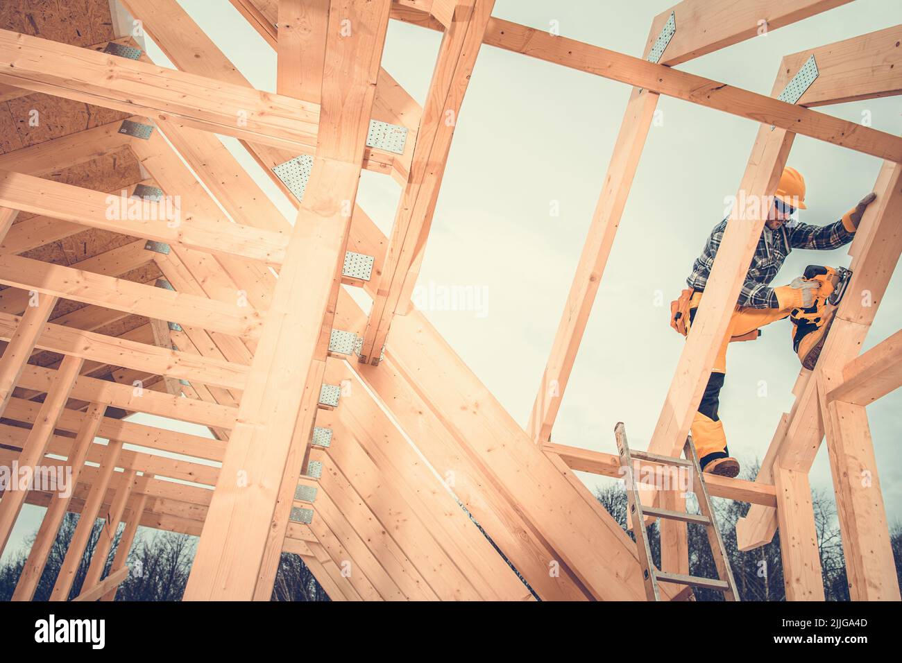 Construction Worker Reinforcing the Wooden Section of a Wooden Frame of ...