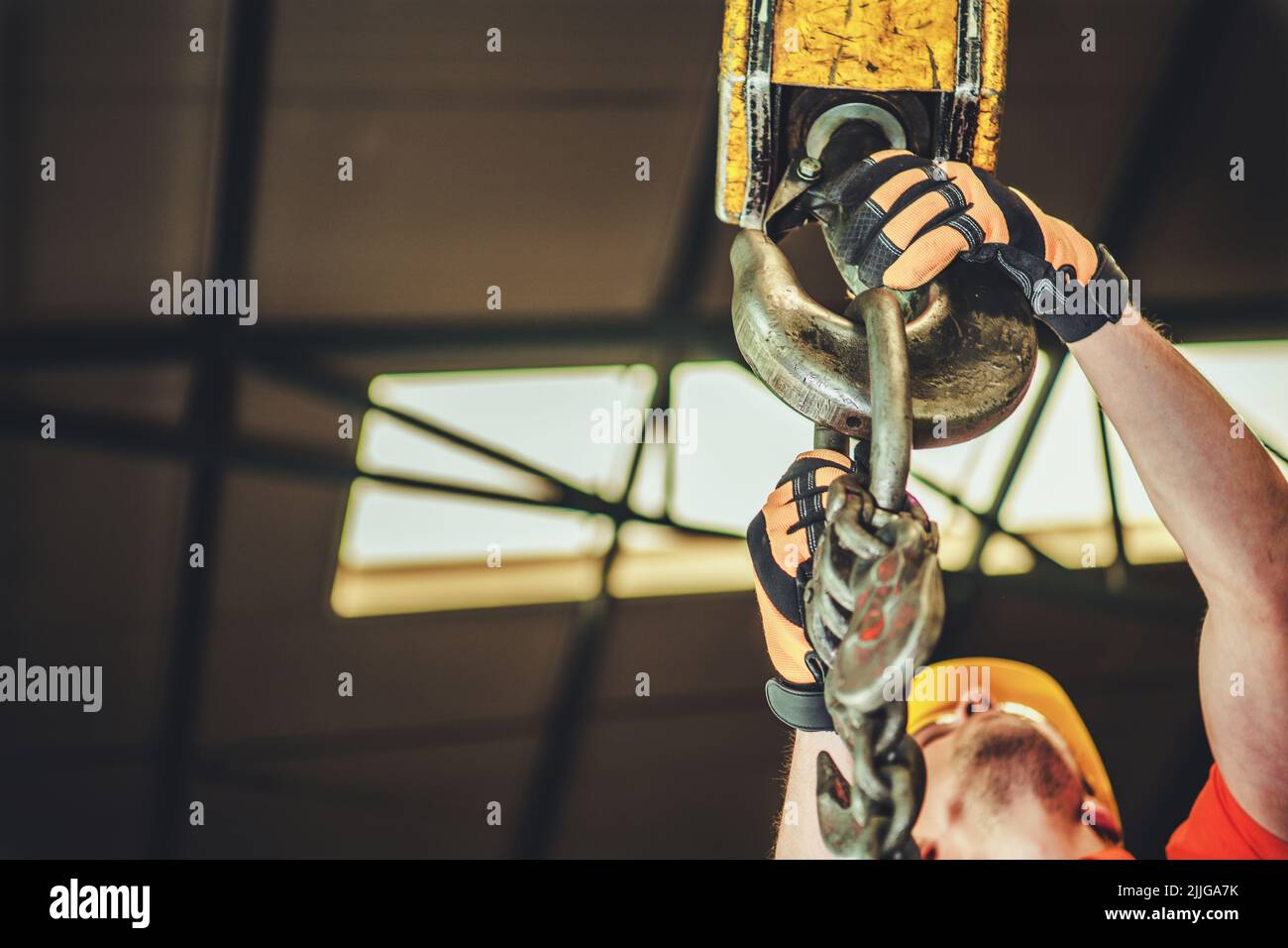 Closeup of Caucasian Contractor Attaching Something to the Lifting Hook ...