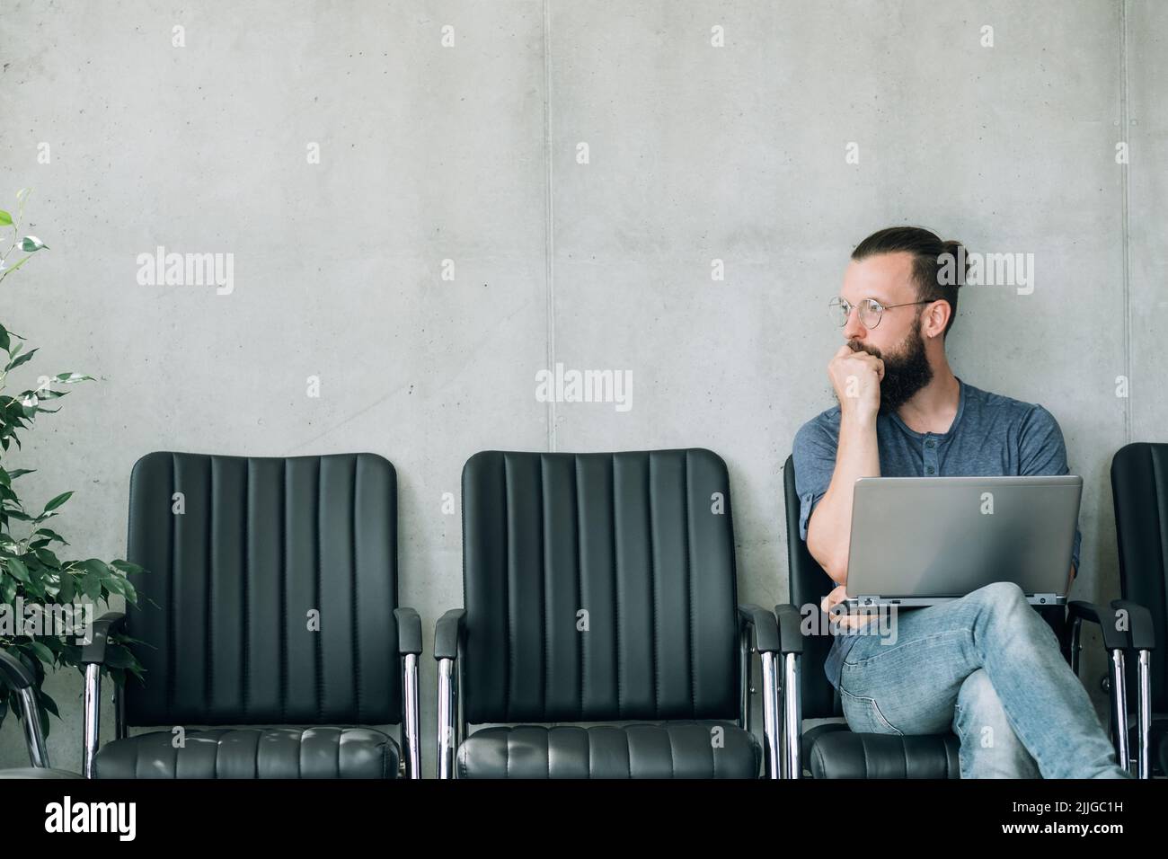 pensive man waiting job interview sitting chair Stock Photo - Alamy