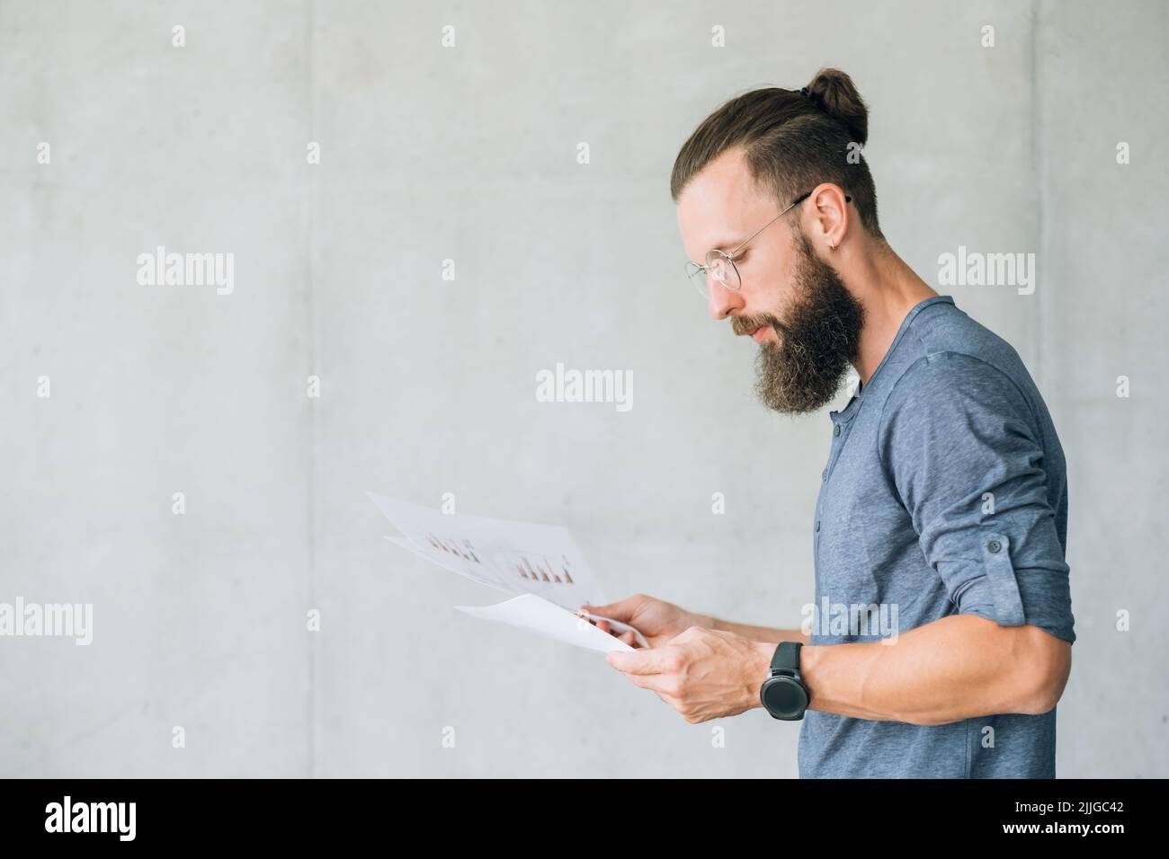 focused man read document information report data Stock Photo - Alamy