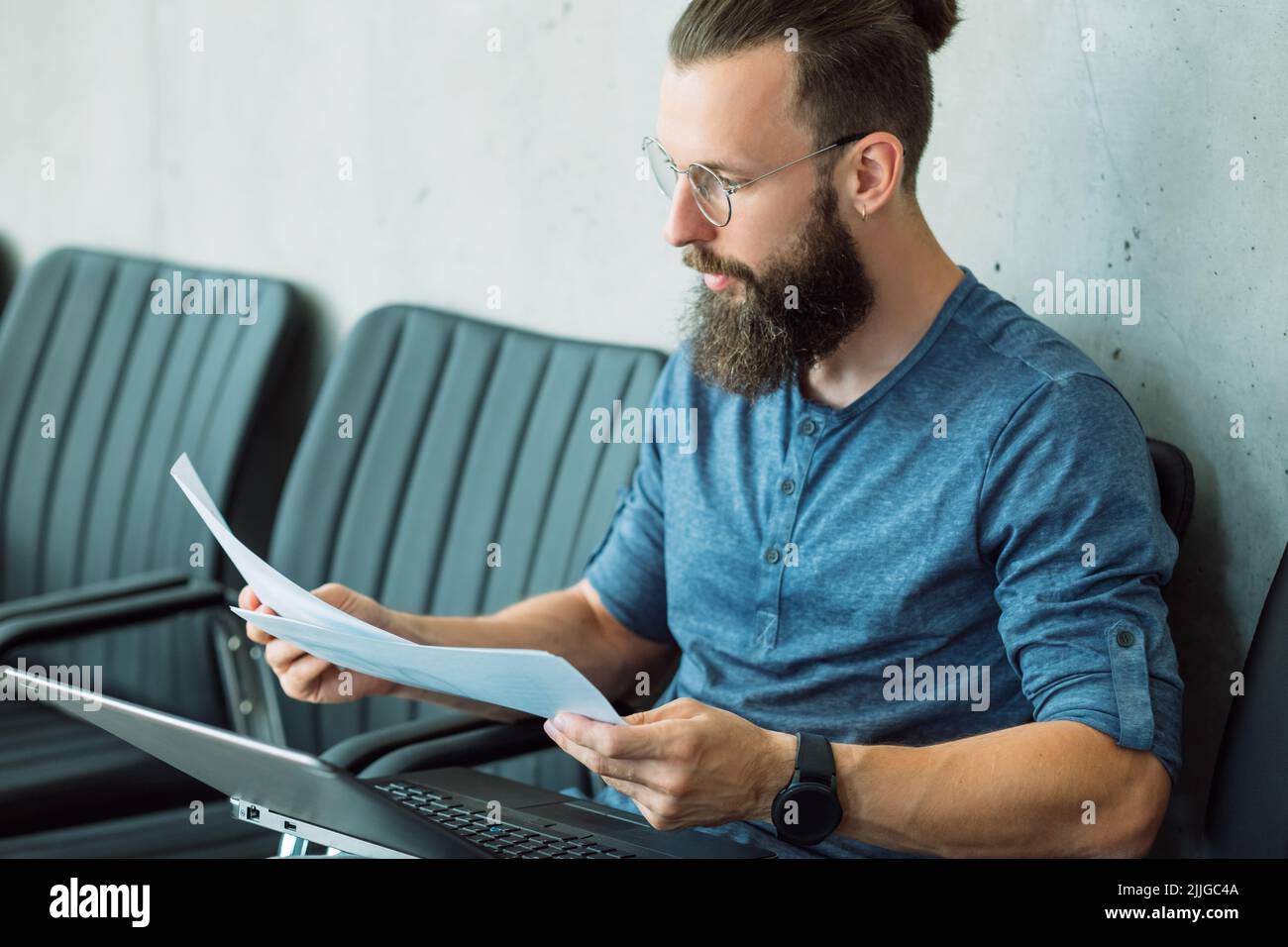 focused man read document information report data Stock Photo - Alamy