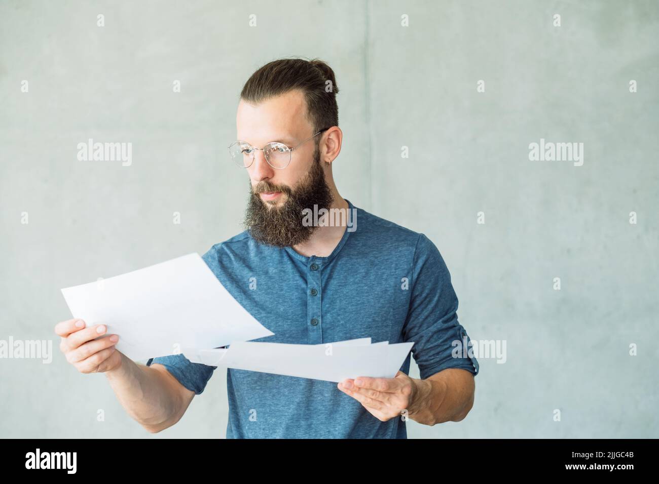 focused man read business documents information Stock Photo - Alamy