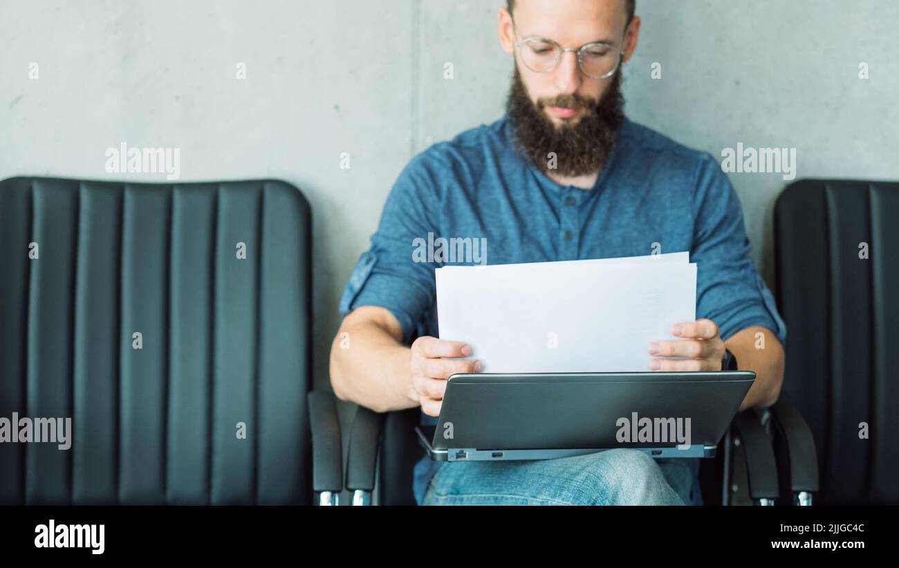 focused man read business documents information Stock Photo - Alamy