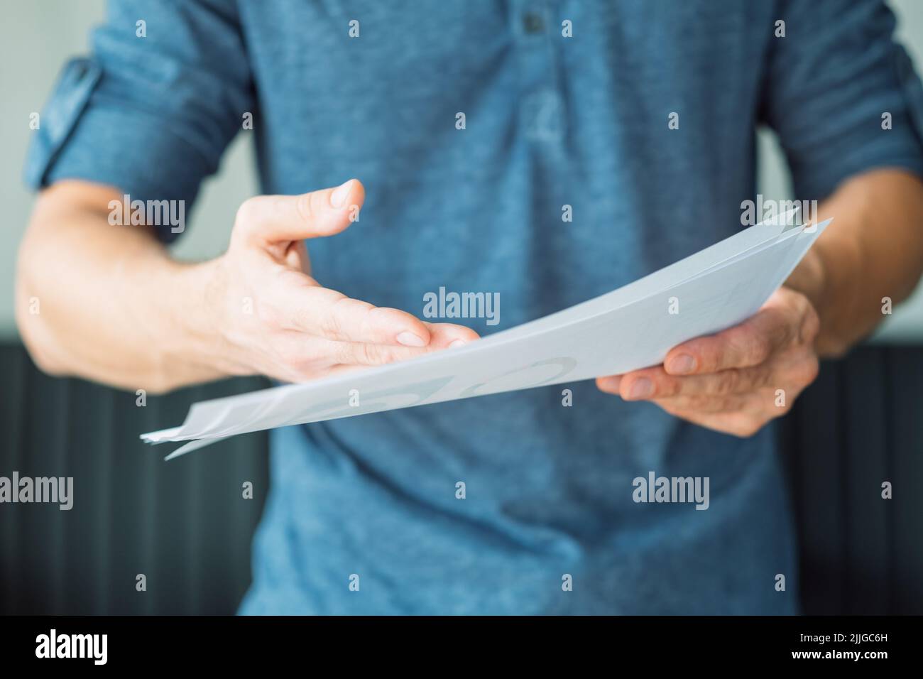 man hand point fact document business papers proof Stock Photo - Alamy