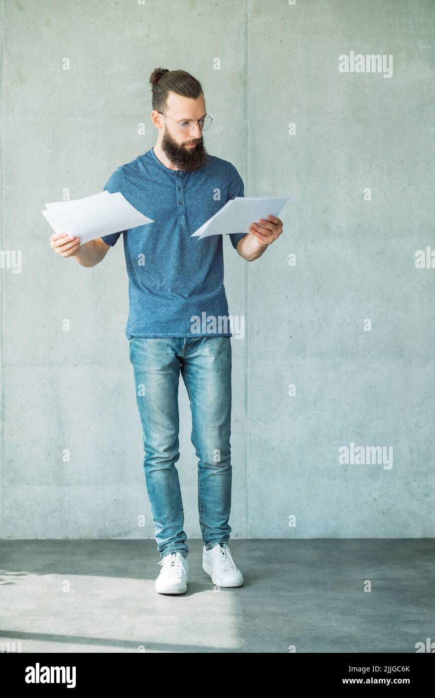 focused man read business documents information Stock Photo - Alamy
