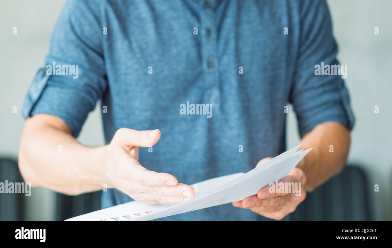 man hand point fact document business papers proof Stock Photo - Alamy