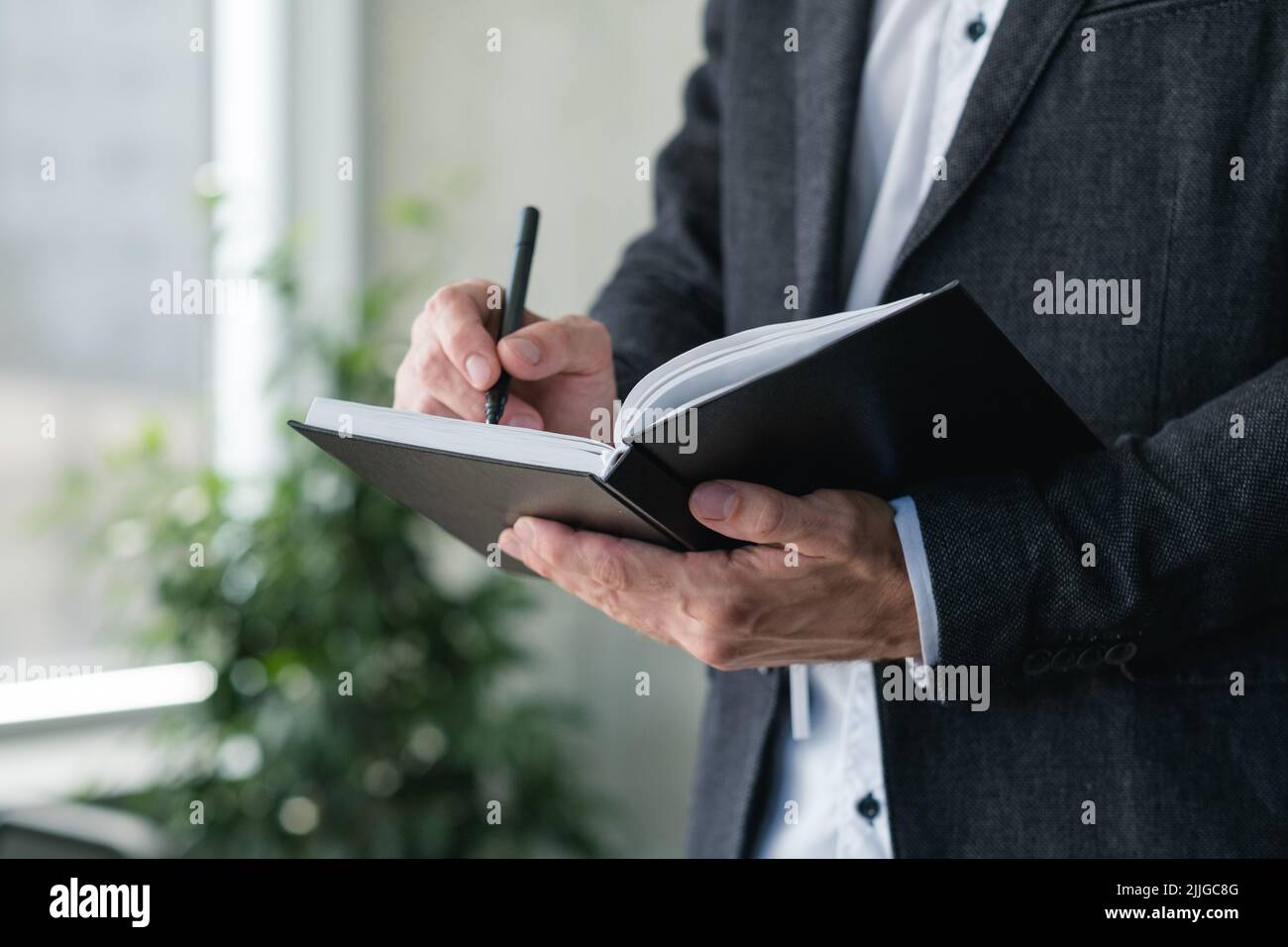 man write notepad agenda schedule business affair Stock Photo - Alamy