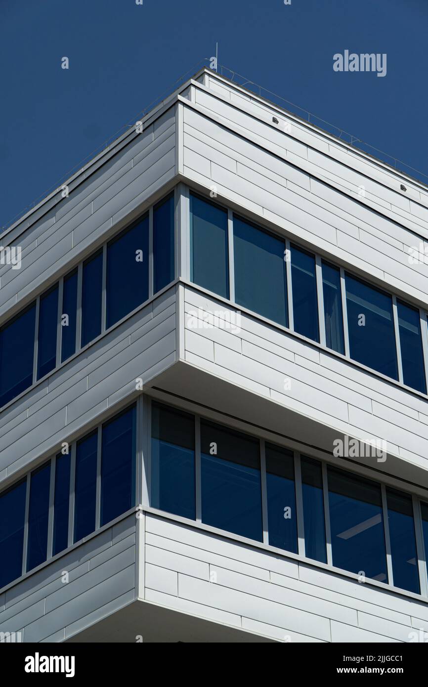 A vertical shot of a corner of a commercial building Stock Photo - Alamy