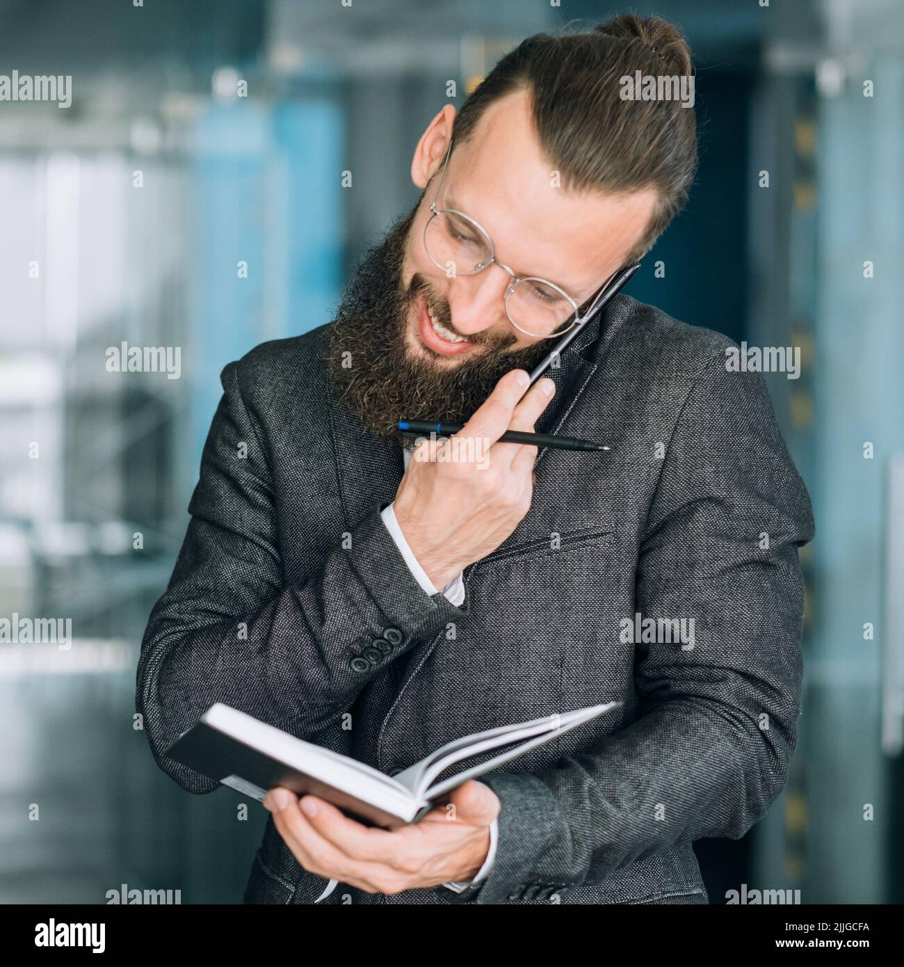 busy business man check day planner talk phone Stock Photo - Alamy