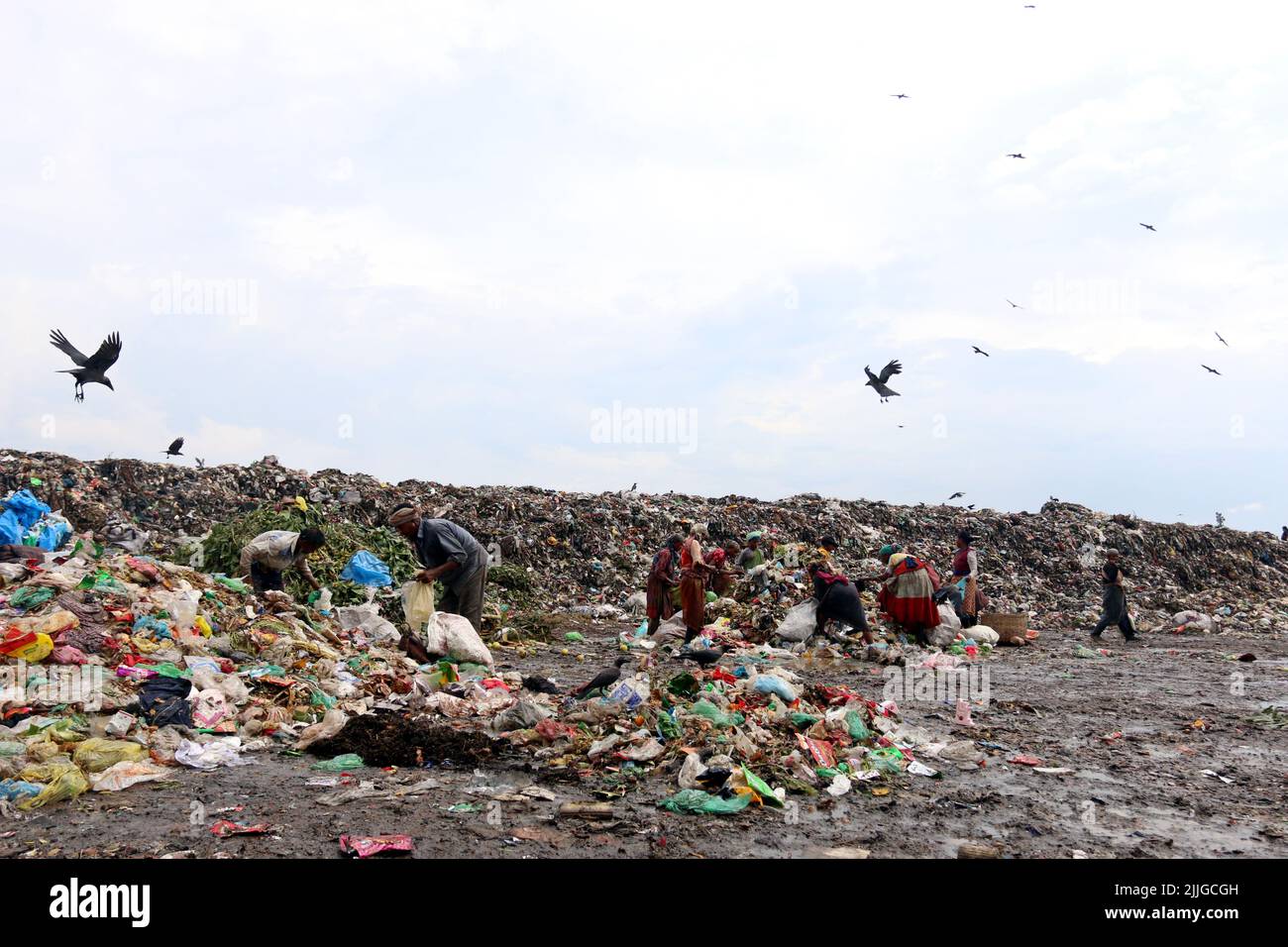 People recycle non-biodegradable waste at a garbage dump in Dhaka to be ...