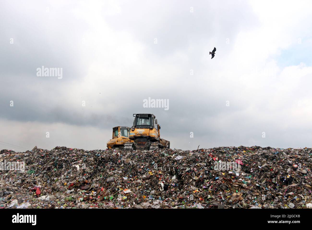People recycle non-biodegradable waste at a garbage dump in Dhaka to be ...