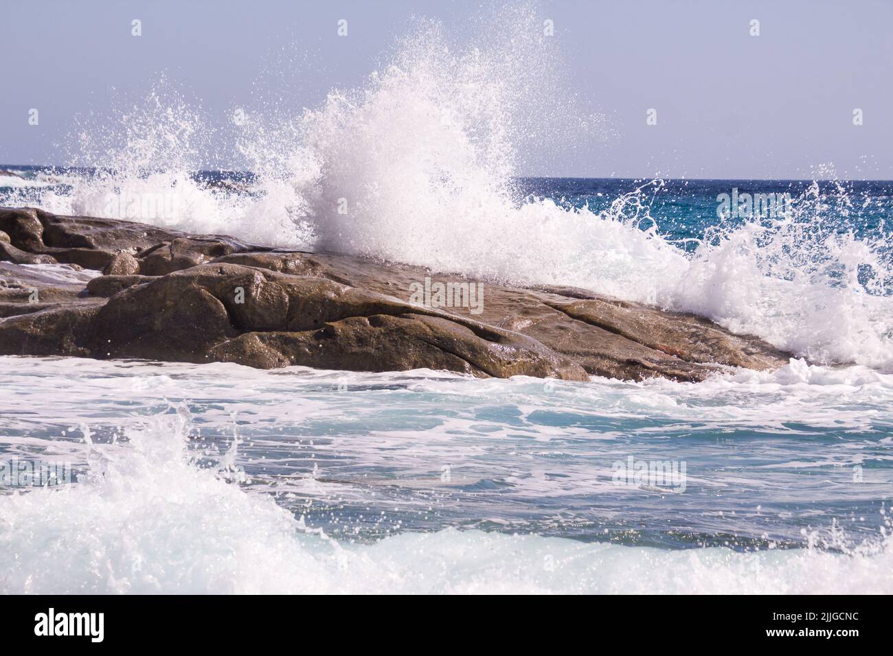 Water splashing against rocks hi-res stock photography and images - Alamy