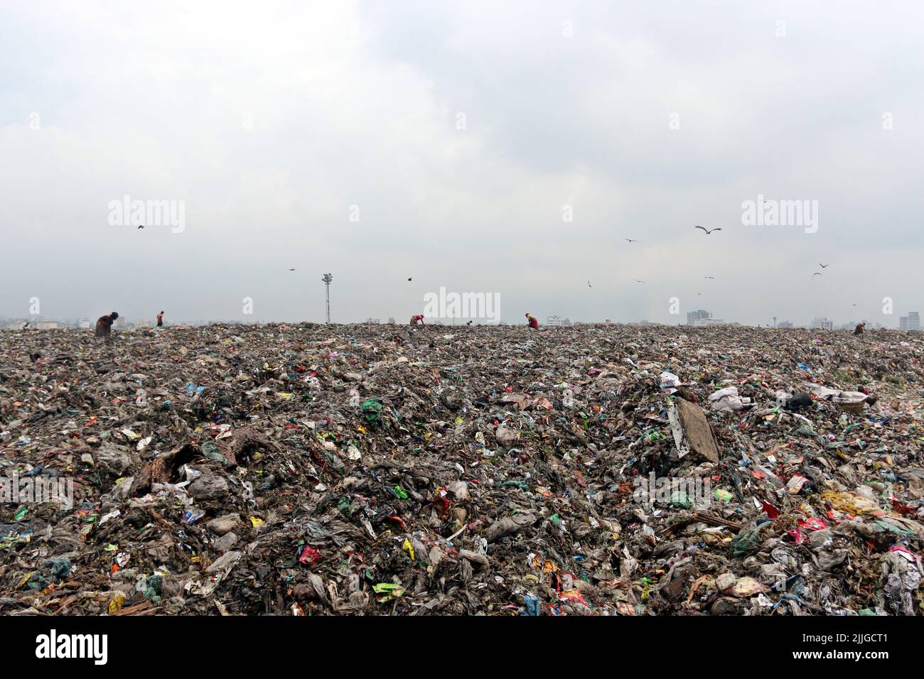 People recycle non-biodegradable waste at a garbage dump in Dhaka to be ...