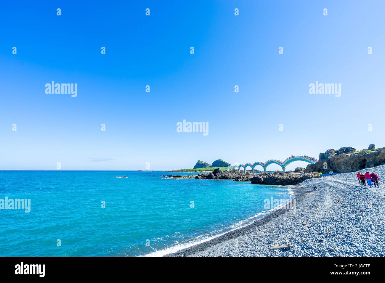 Beautiful scenic of Sanxiantai arch bridge with blue ocean with Three ...