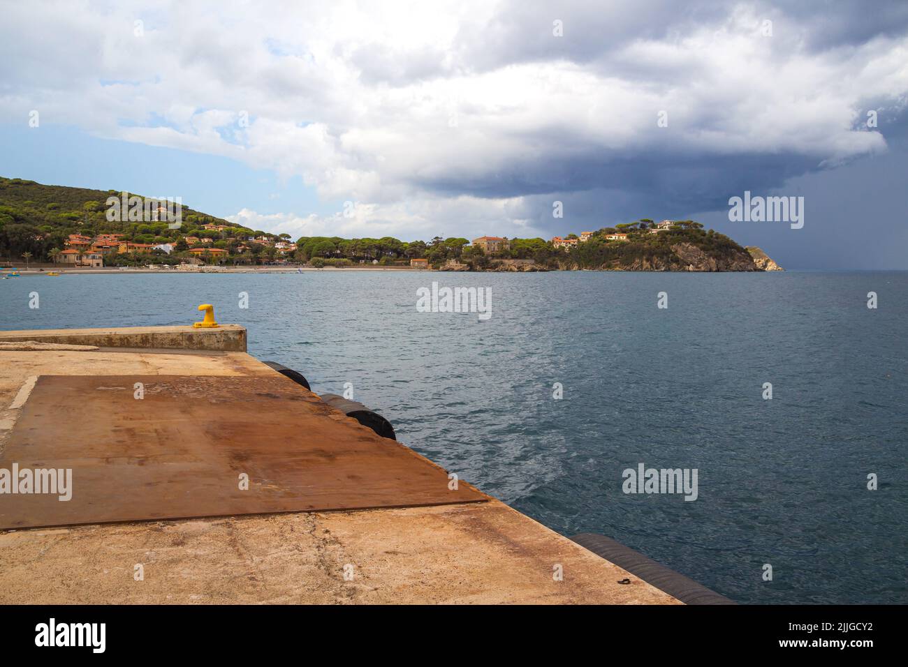 Port of Cavo with dramatic sky before thunderstorm at Cavo, Island of ...