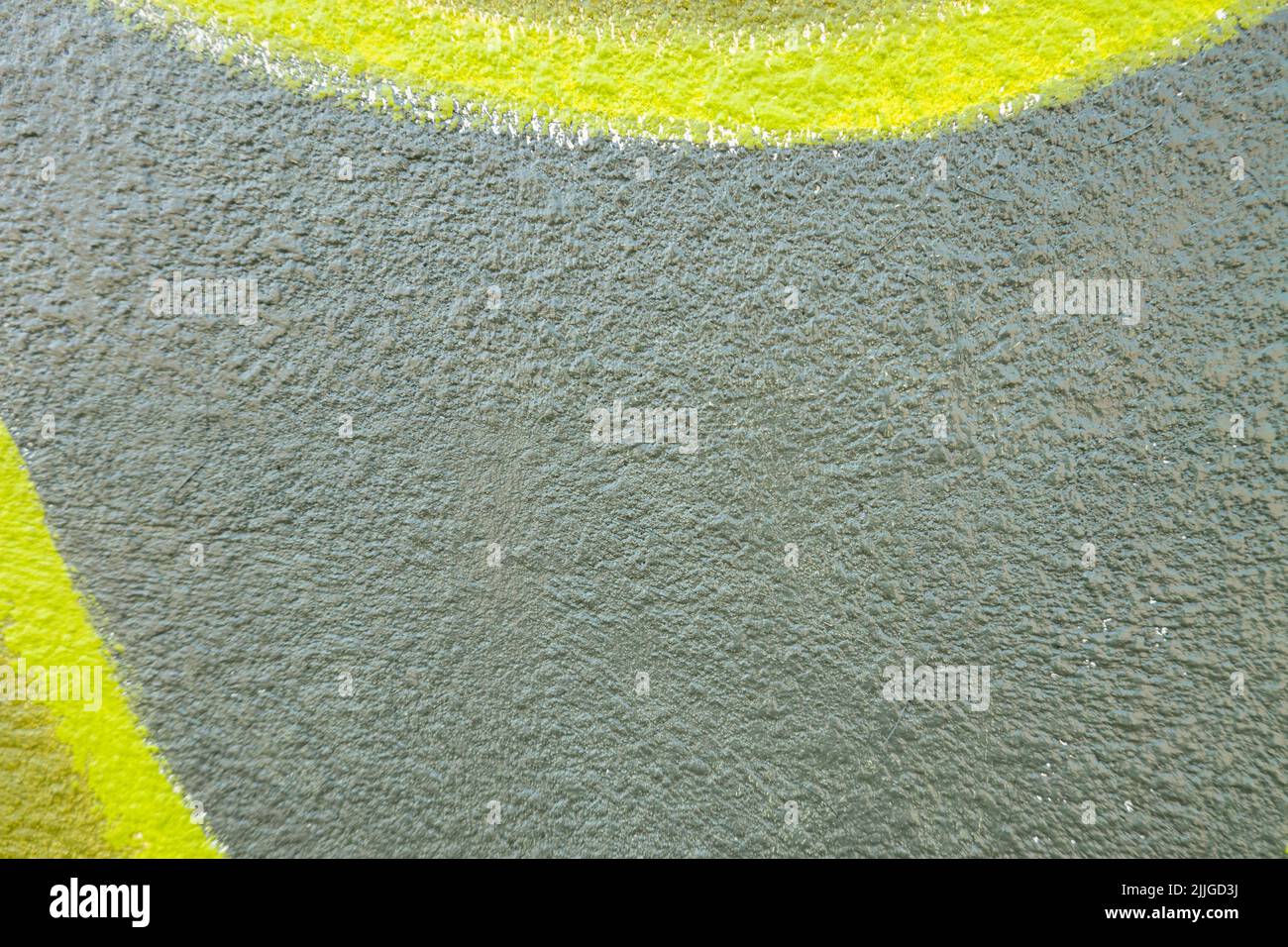 Fragment of the wall with colorful graffiti painting in the street ...