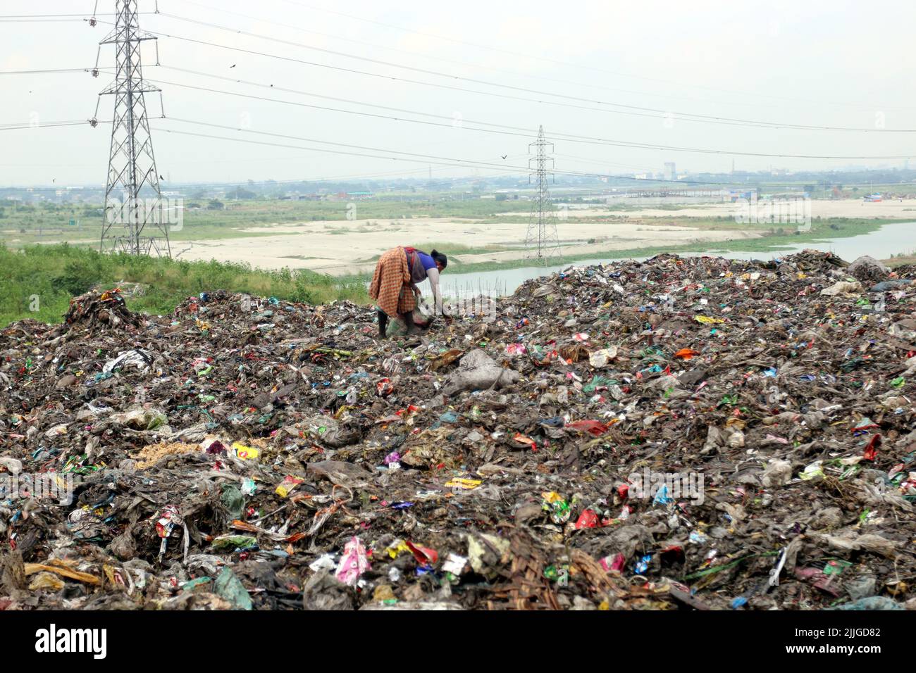 People recycle non-biodegradable waste at a garbage dump in Dhaka to be ...