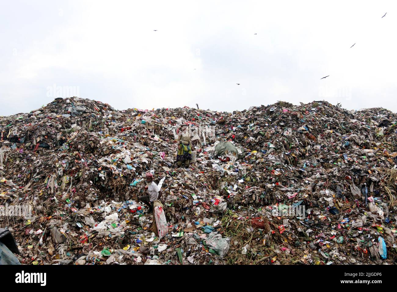People recycle non-biodegradable waste at a garbage dump in Dhaka to be ...