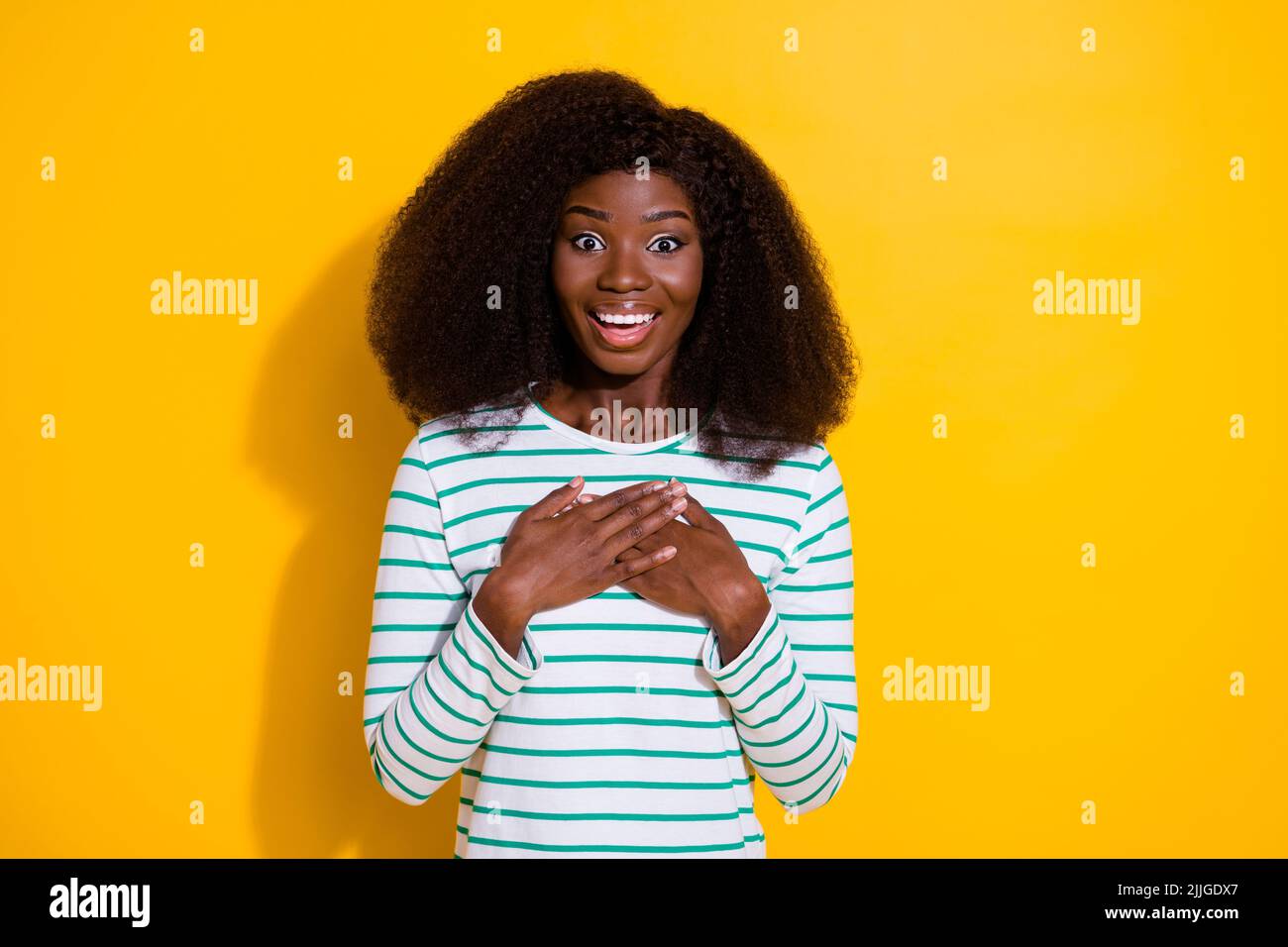 Photo of impressed positive lady hands touch chest cant believe toothy ...