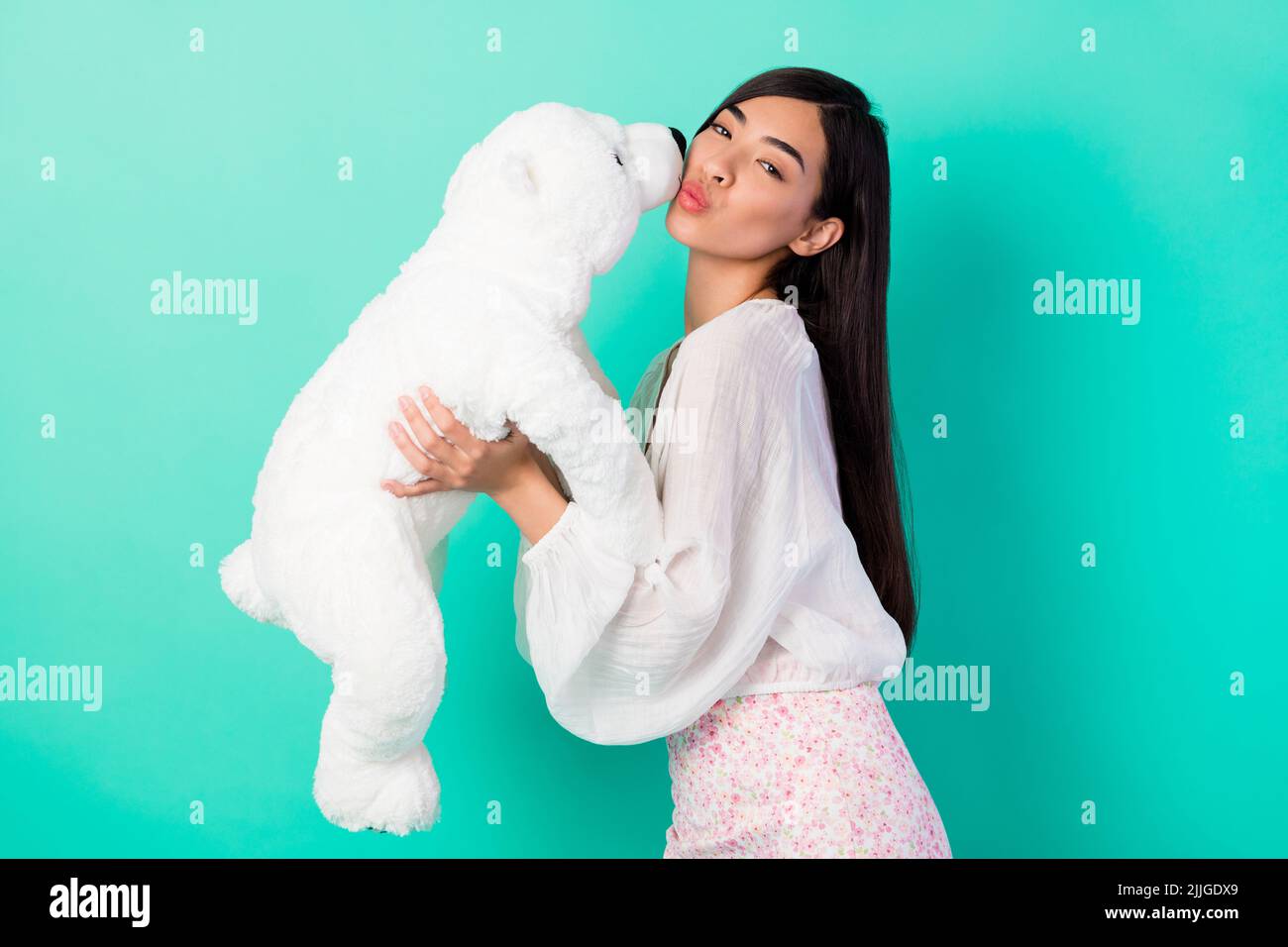 Photo of girlish nice lady get kiss from white soft teddy bear isolated ...