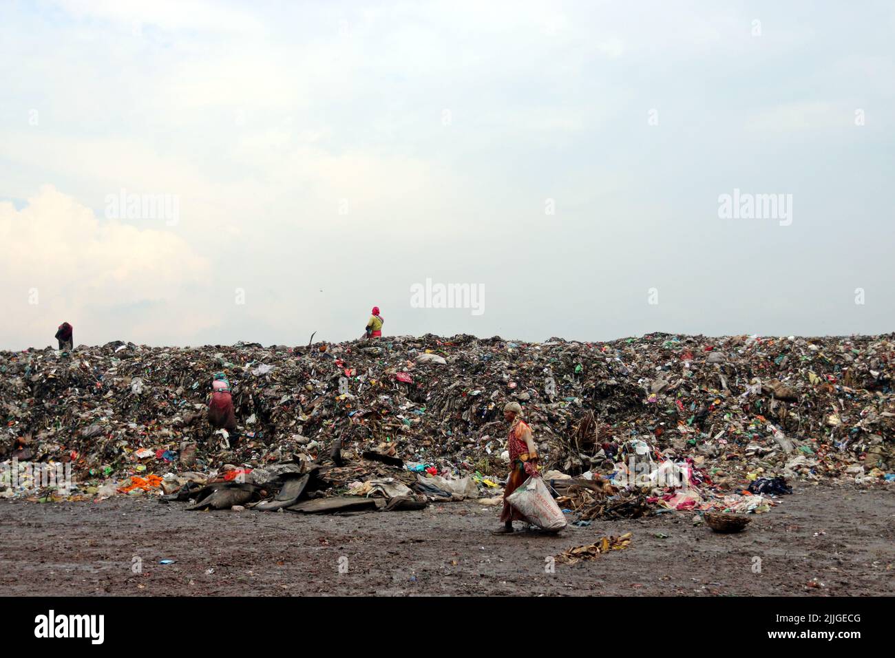 People recycle non-biodegradable waste at a garbage dump in Dhaka to be ...
