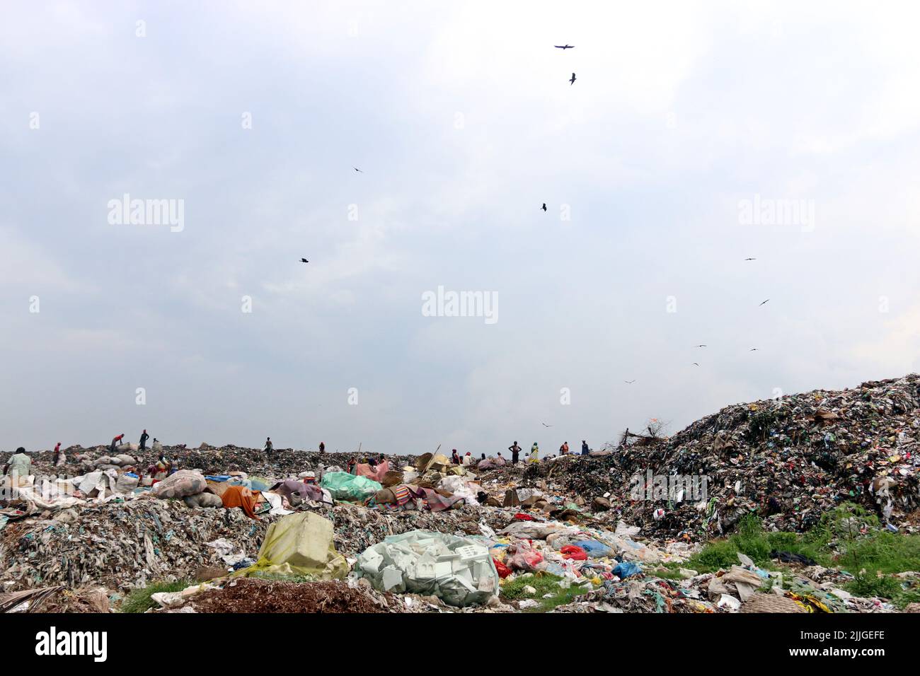People recycle non-biodegradable waste at a garbage dump in Dhaka to be ...