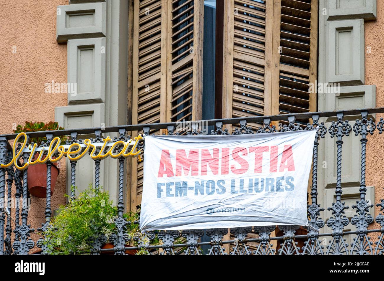 Sign in a home balcony reading 'Amnesty let us be free' Stock Photo - Alamy