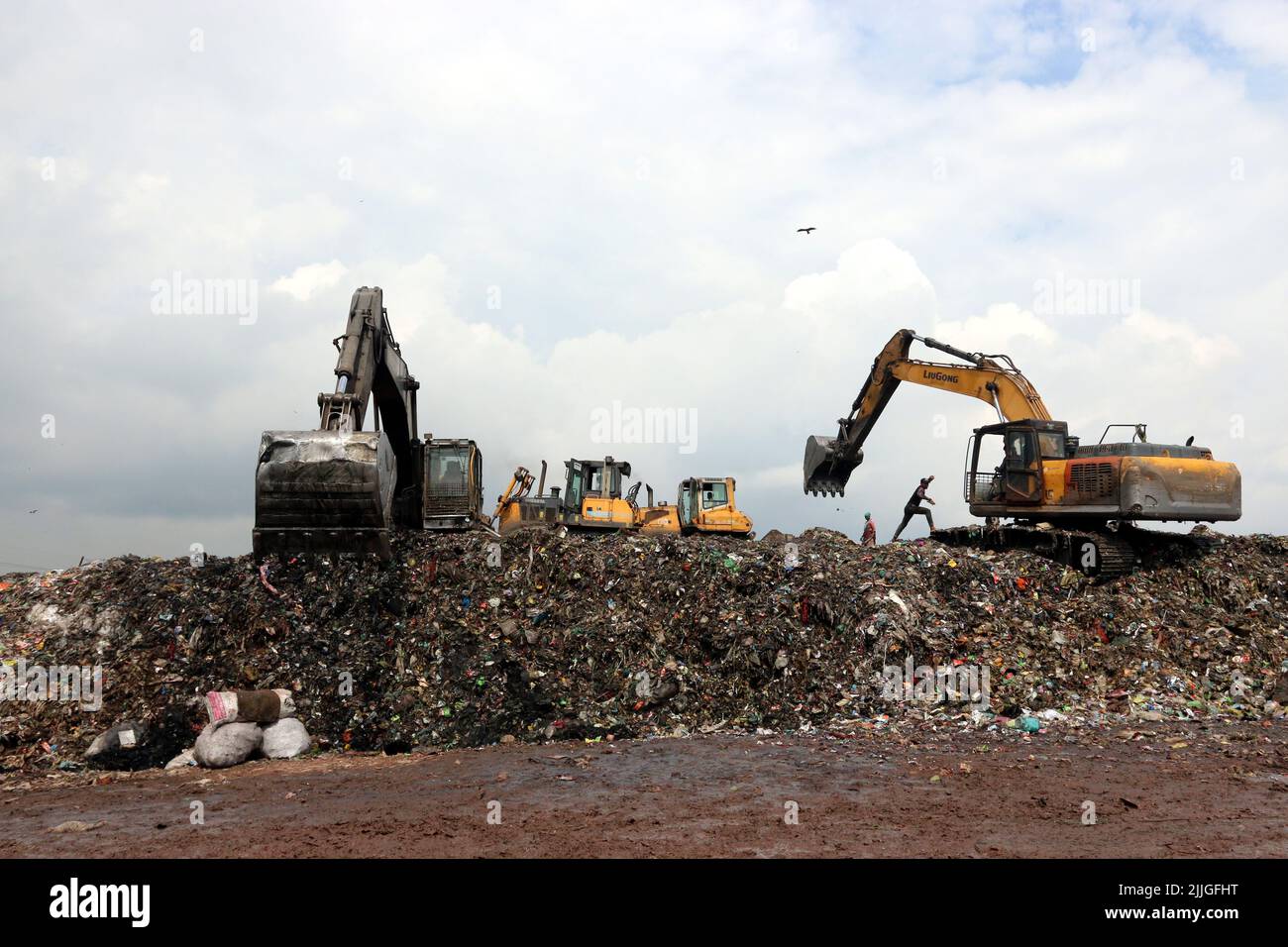 People recycle non-biodegradable waste at a garbage dump in Dhaka to be ...
