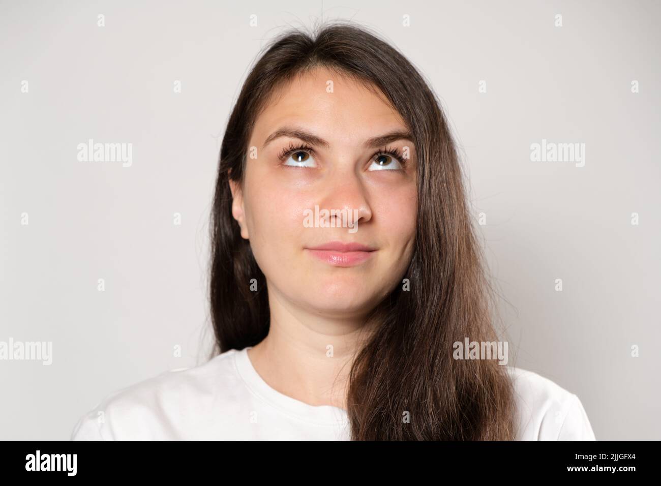 The woman looks up, does exercises for the eyes. Eye muscle training ...