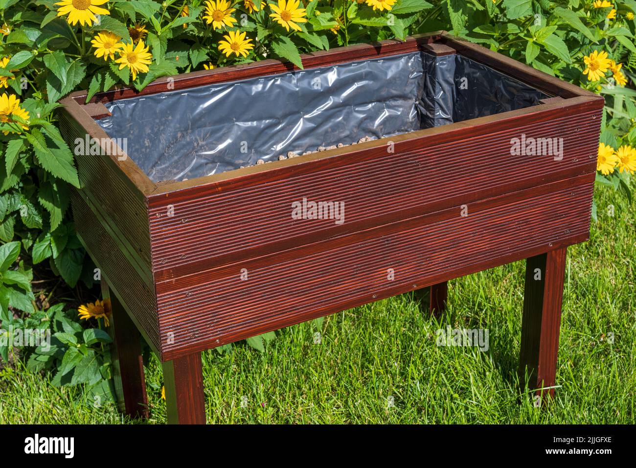 Self-made wooden pot with a layer of expanded clay. Preparation for ...