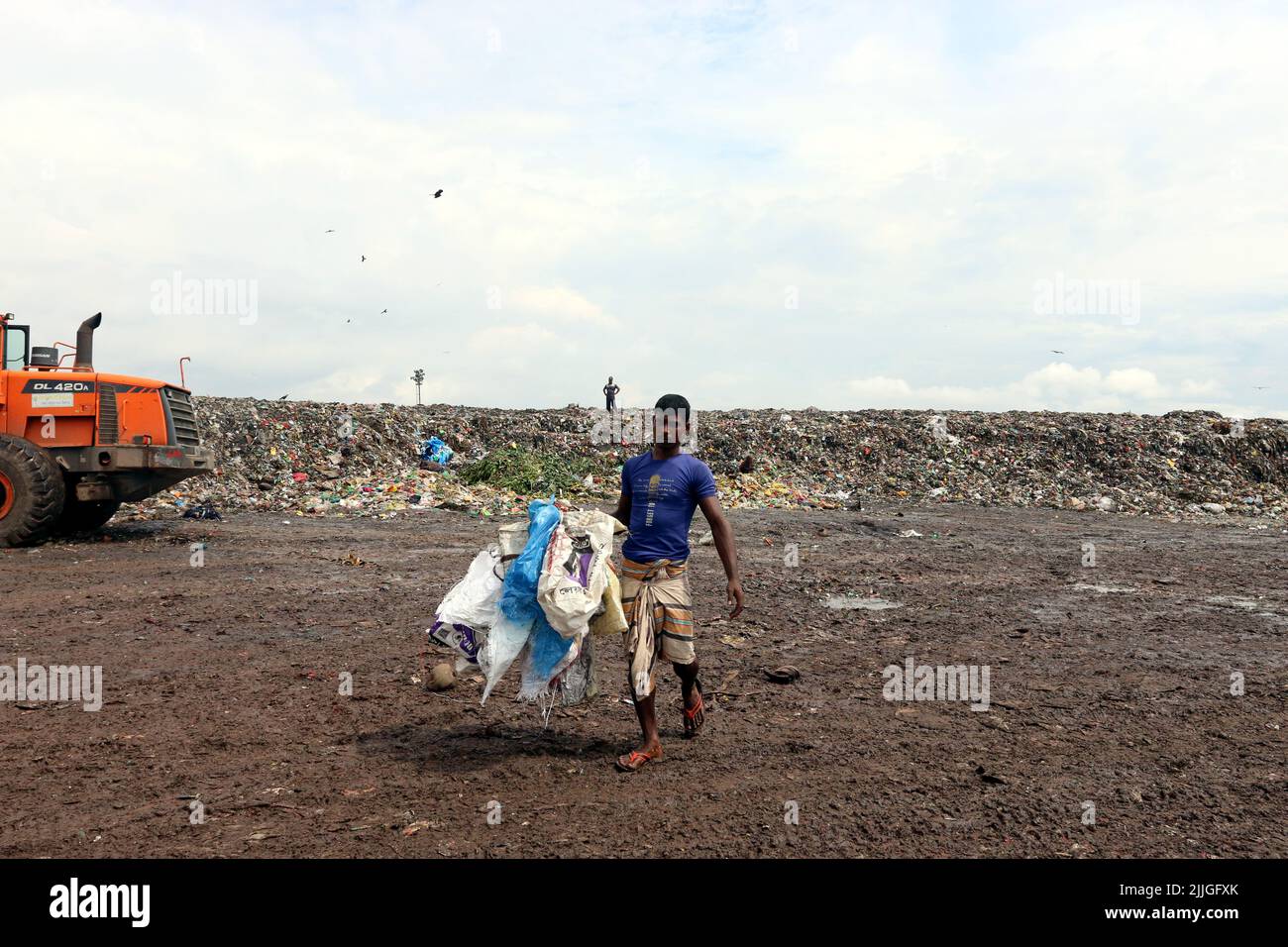 People recycle non-biodegradable waste at a garbage dump in Dhaka to be ...