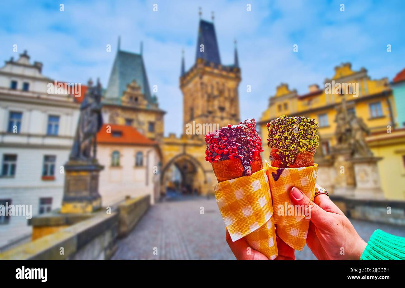 Tasty traditional trdelnik Bohemian pastry in front of Mala Strana ...