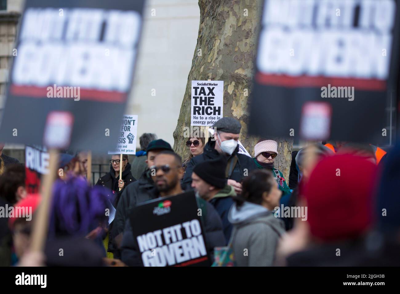 Placards are held as participants gather during a Cost of Living Crisis ...