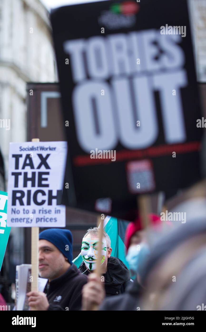 Placards are held as participants gather during a Cost of Living Crisis ...