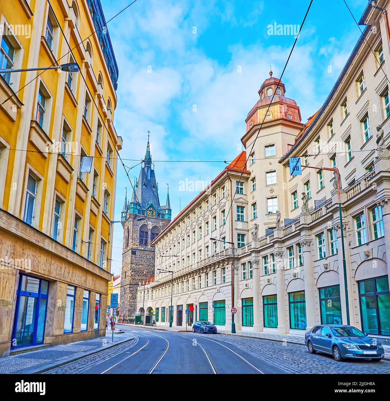 The narrow curved street with tall buildings and Gothic stone Henry's ...
