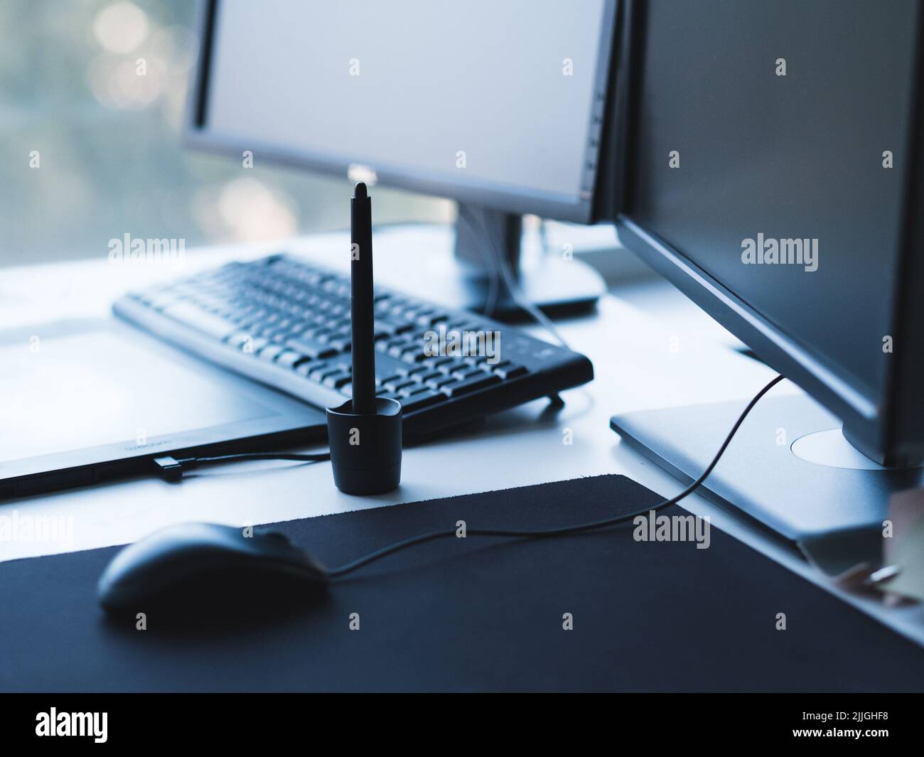 web graphic designer workplace tablet monitors Stock Photo - Alamy