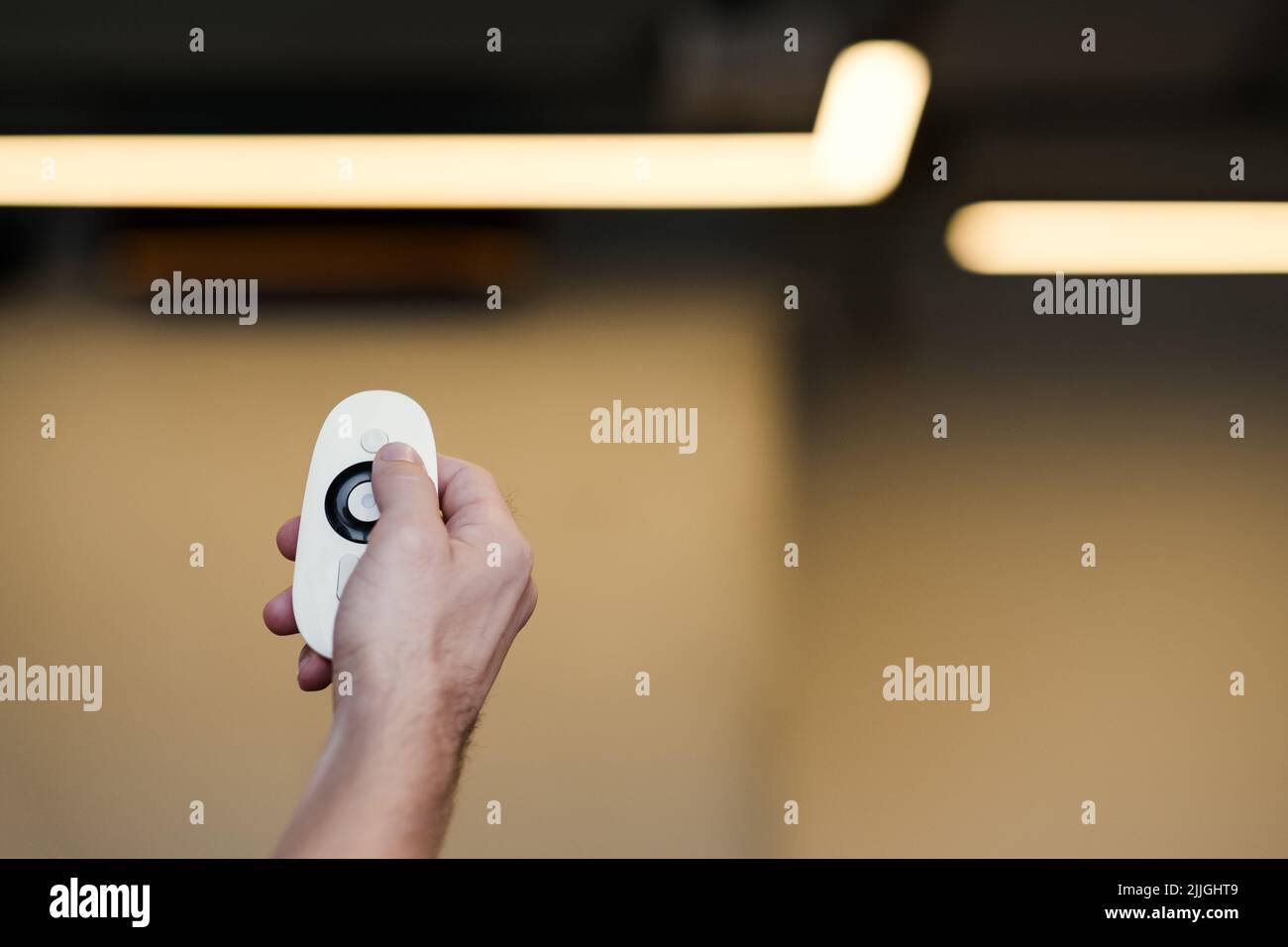 wireless electronic devices remote control man Stock Photo - Alamy