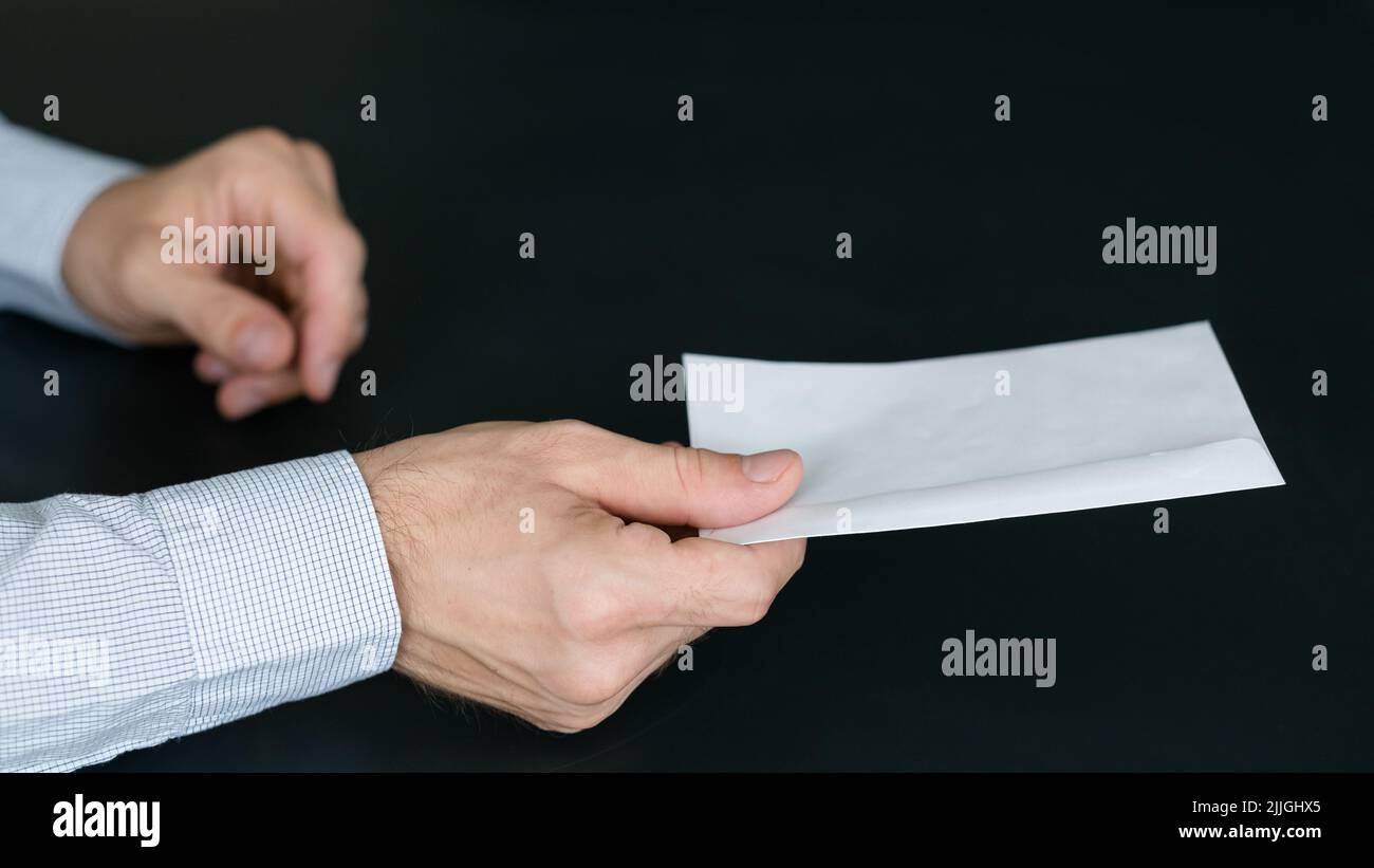 mail delivery service man passing envelope letter Stock Photo - Alamy