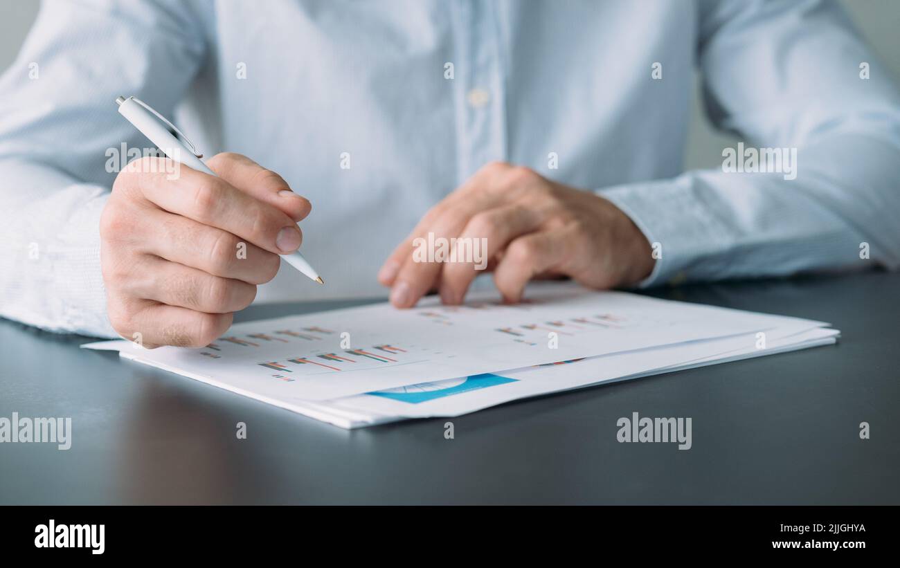 business analysis man working graphs charts Stock Photo - Alamy