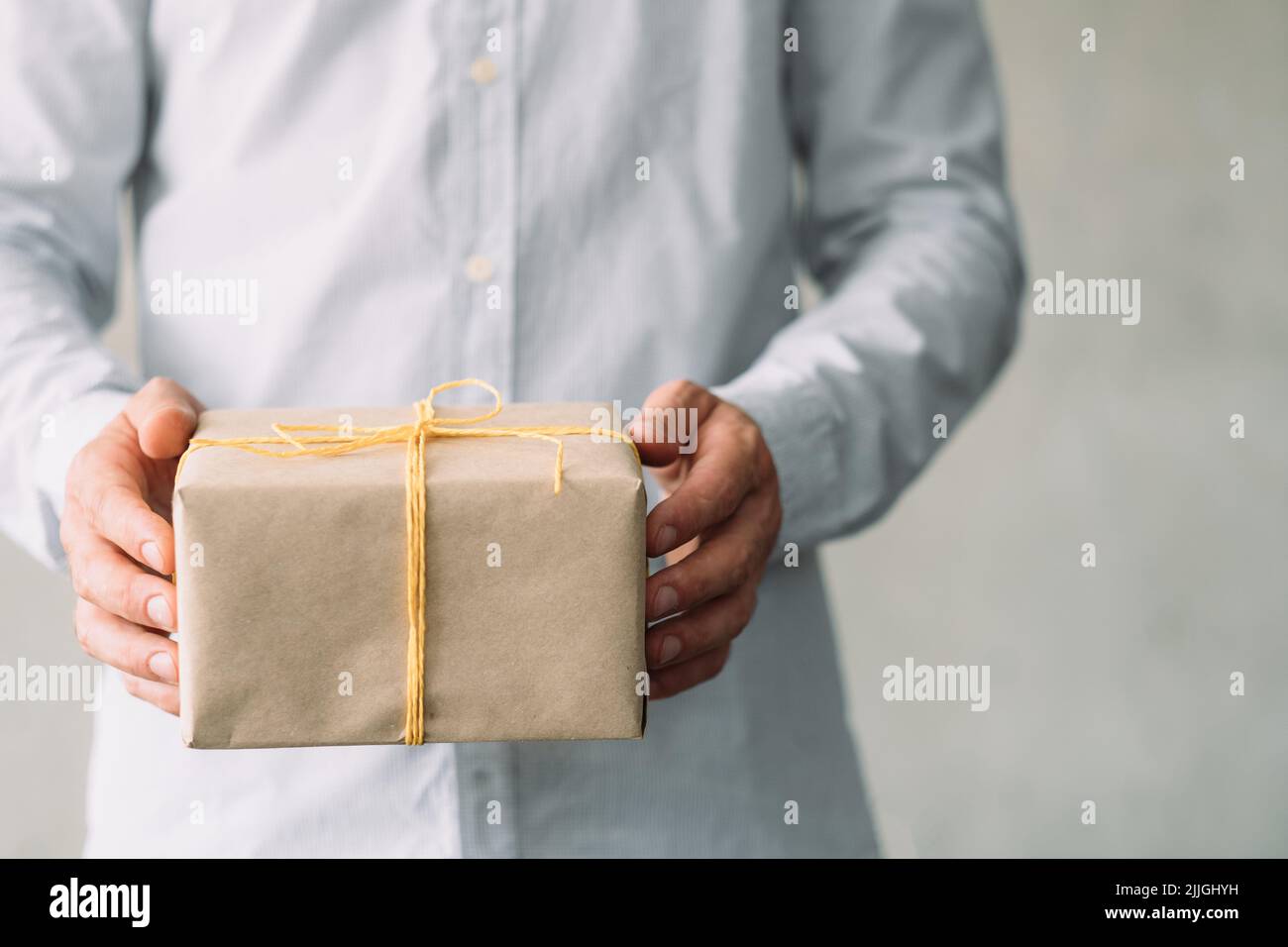 goods delivery service business man wrapped box Stock Photo - Alamy