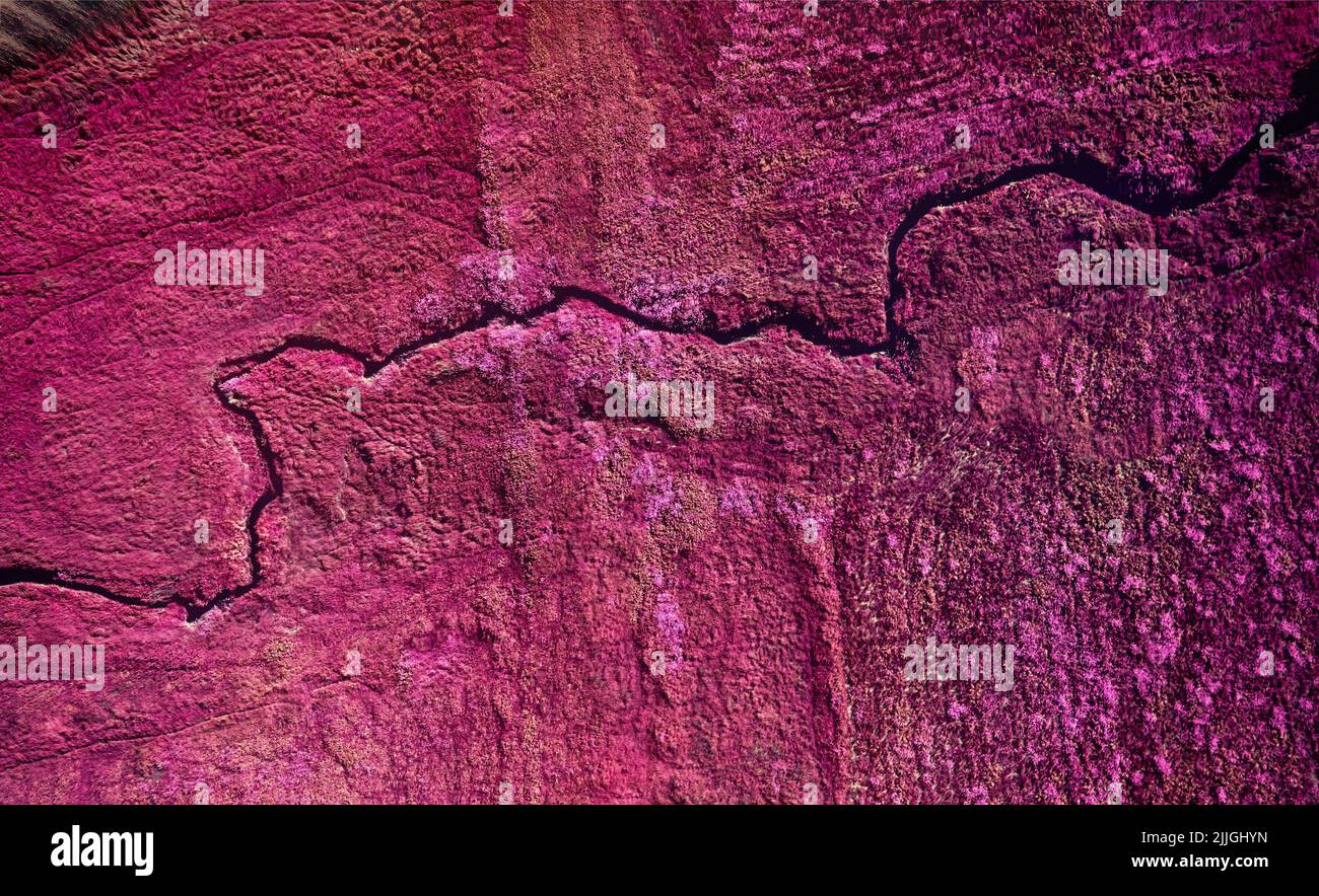 An aerial view of a purple landscape with a curved path in Greece Stock ...