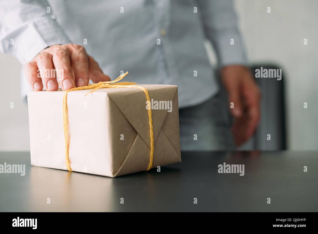 goods delivery service wrapped box office Stock Photo - Alamy