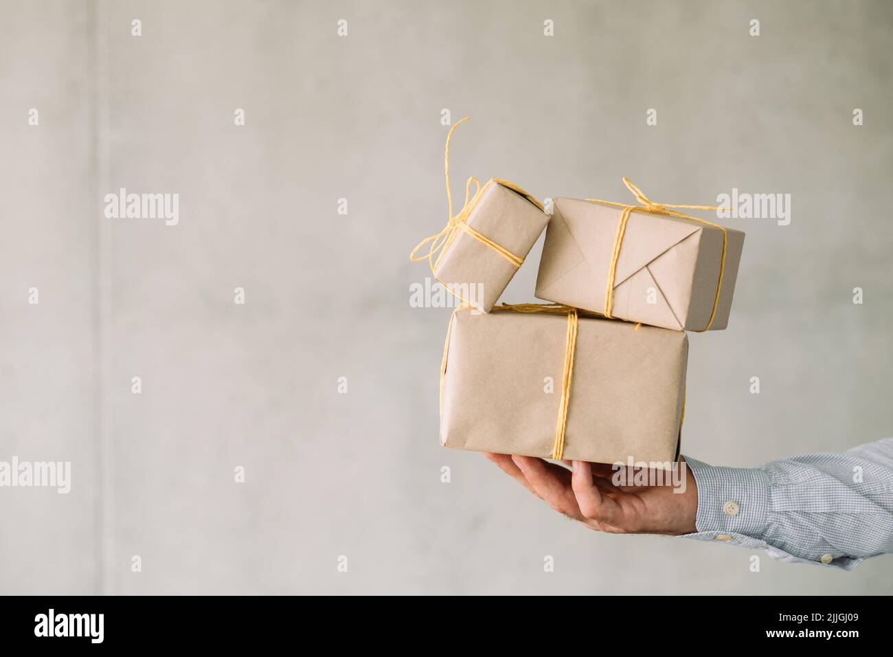 online shopping delivery service man wrapped box Stock Photo - Alamy