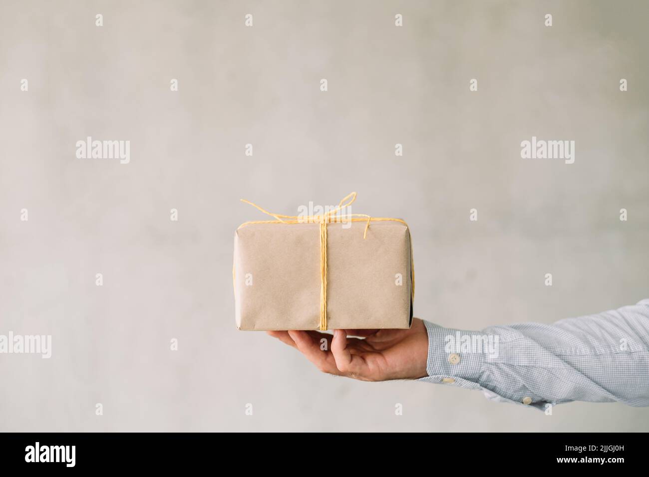 office food delivery service man wrapped box Stock Photo - Alamy