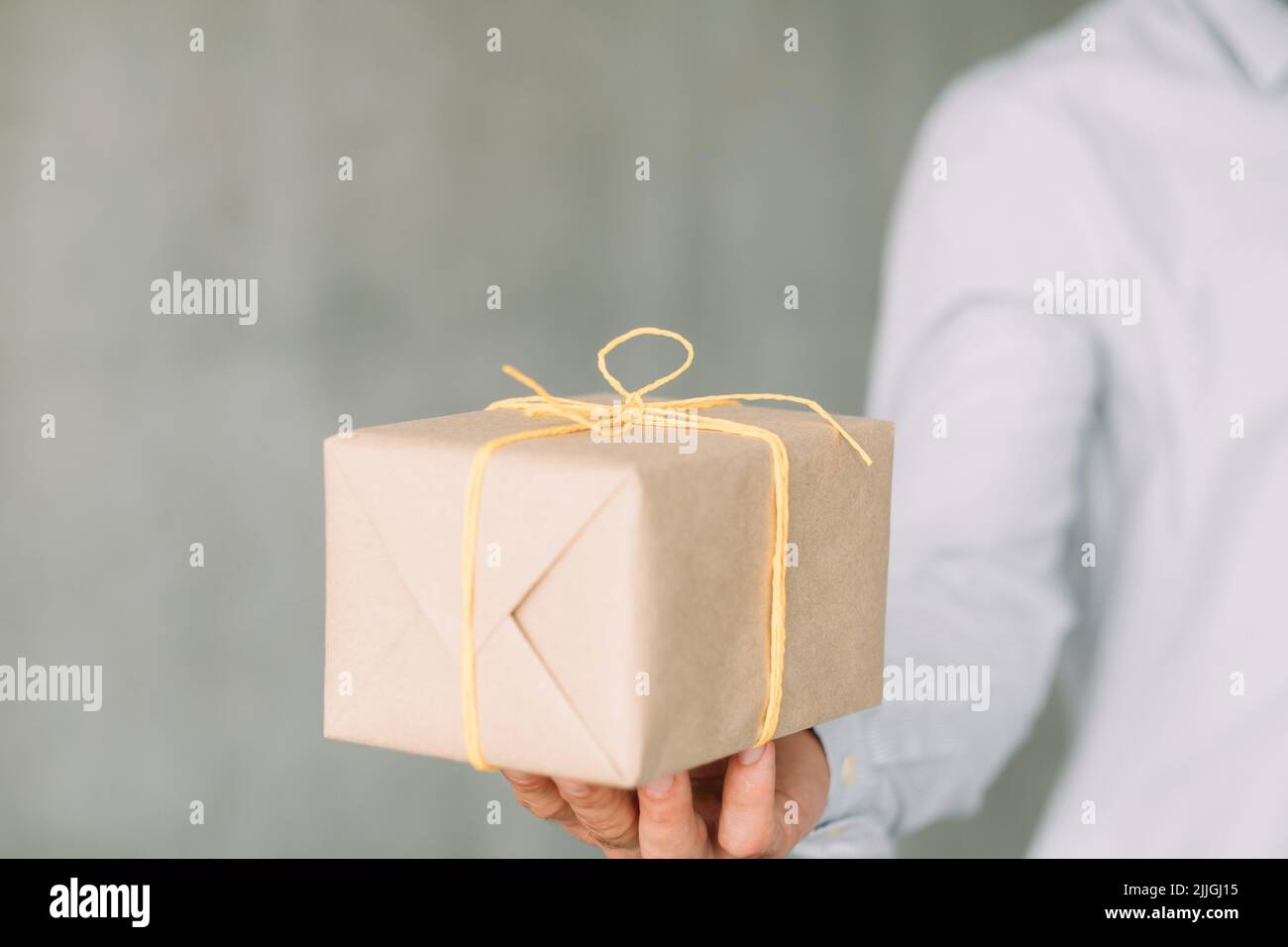 online food office delivery man wrapped box Stock Photo - Alamy