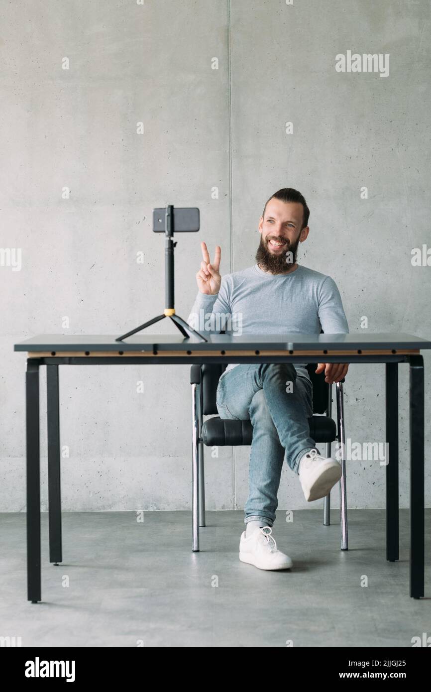 social vlog man smartphone greeting subscribers Stock Photo - Alamy